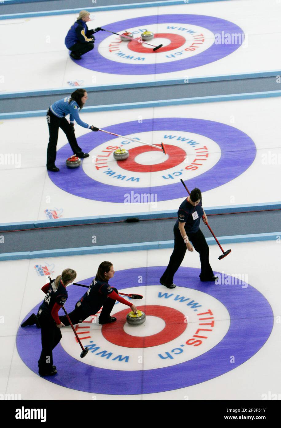 United States's skip Deb McCormick, bottom center, prepares to release ...