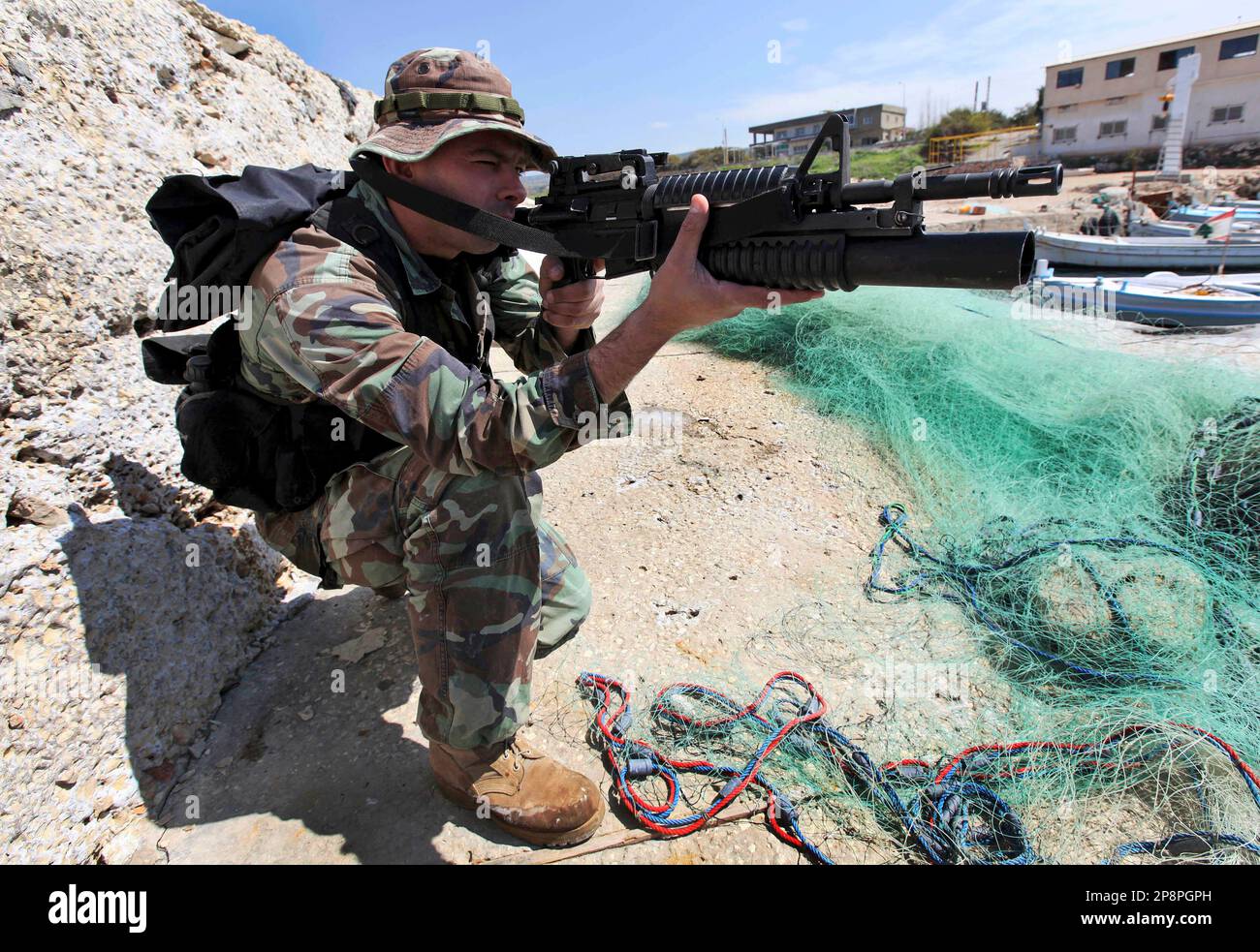A Lebanese marine special forces soldier, takes position during a joint ...