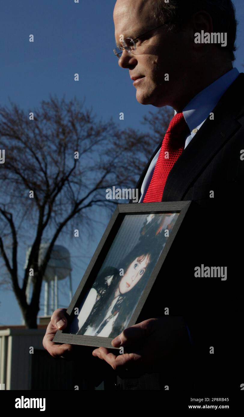 King Co. (Wash.) prosecuting attorney Dan Satterberg holds a photo of ...