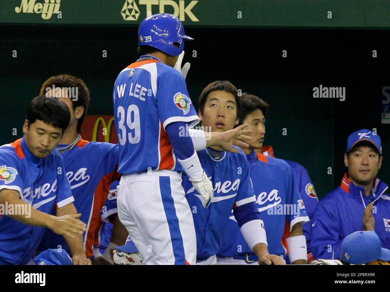 Team South Korea centerfielder Lee Jong-wook (39) celebrates with ...