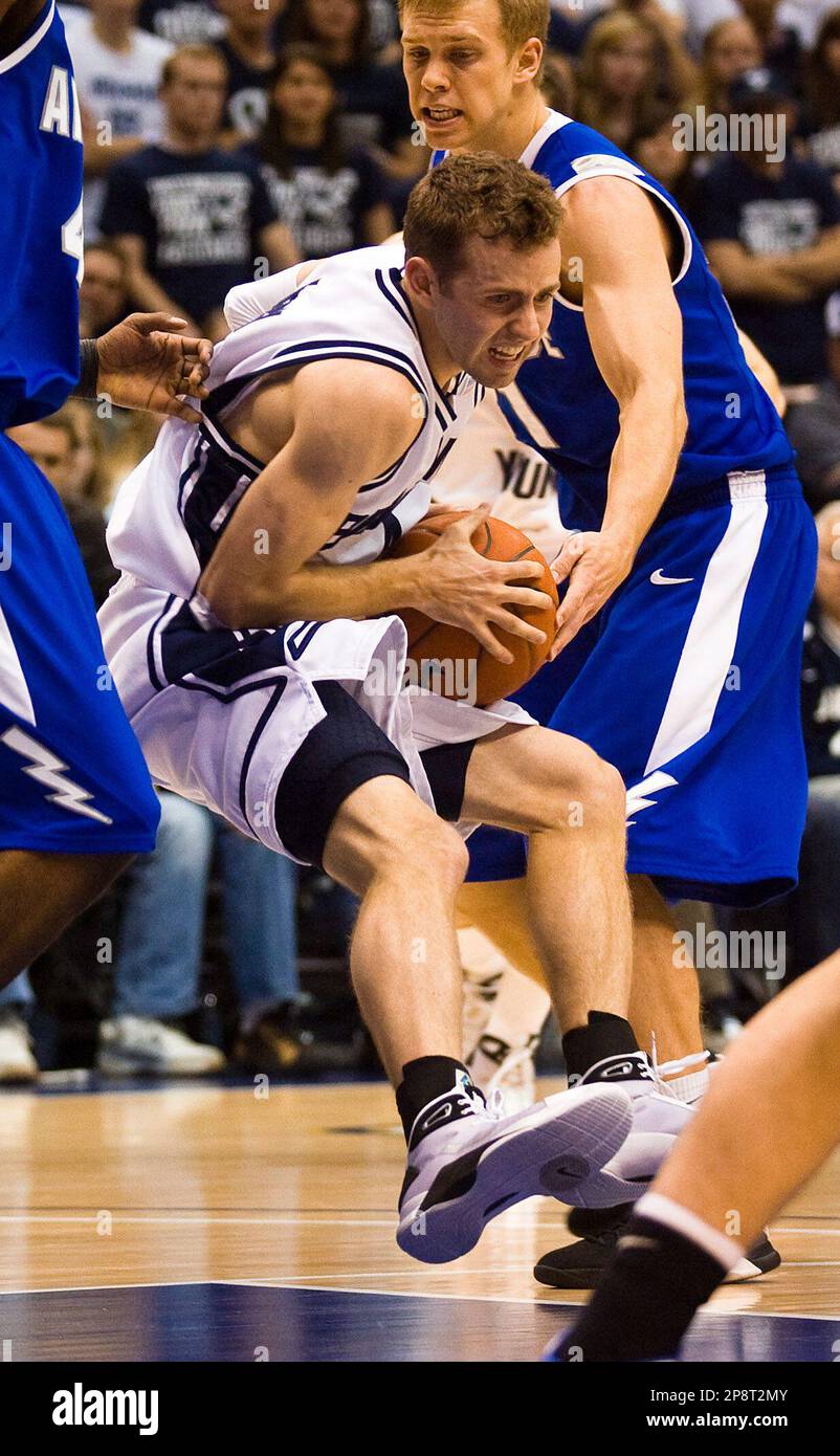 BYU guard Jackson Emery (4) drives through Air Force's Anwar Johnson ...