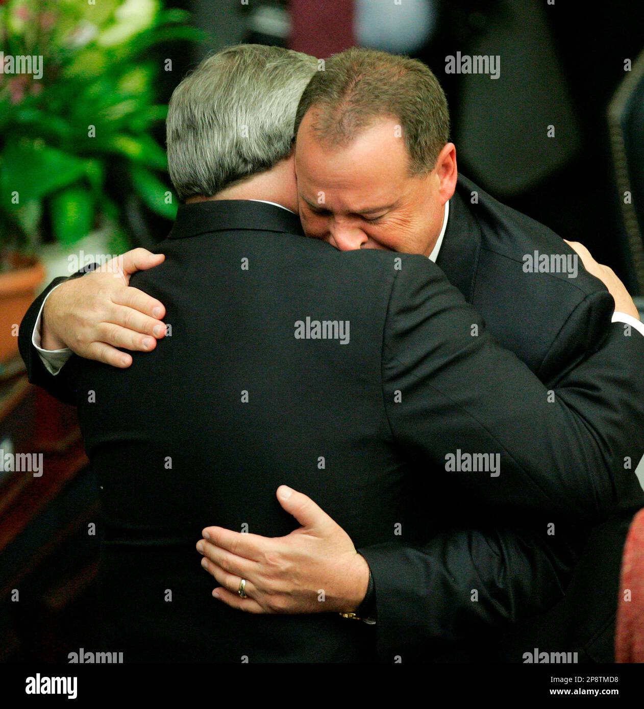 Former House Speaker Rep. Ray Sansom, R-Destin, right, hugs Rep. Larry Cretul, R-Ocala, who ...