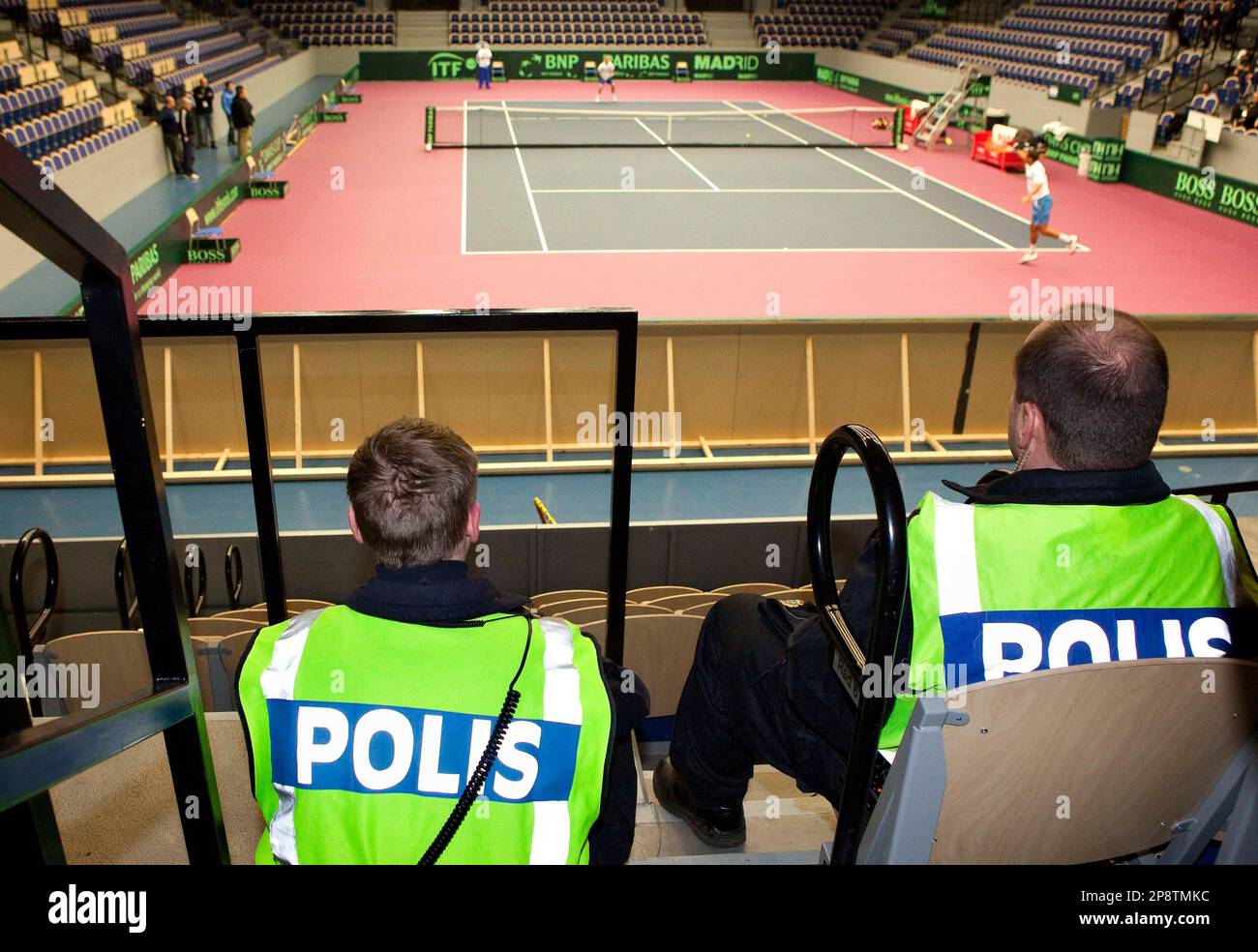 Police officers watch Israeli Davis Cup team tennis players training in ...
