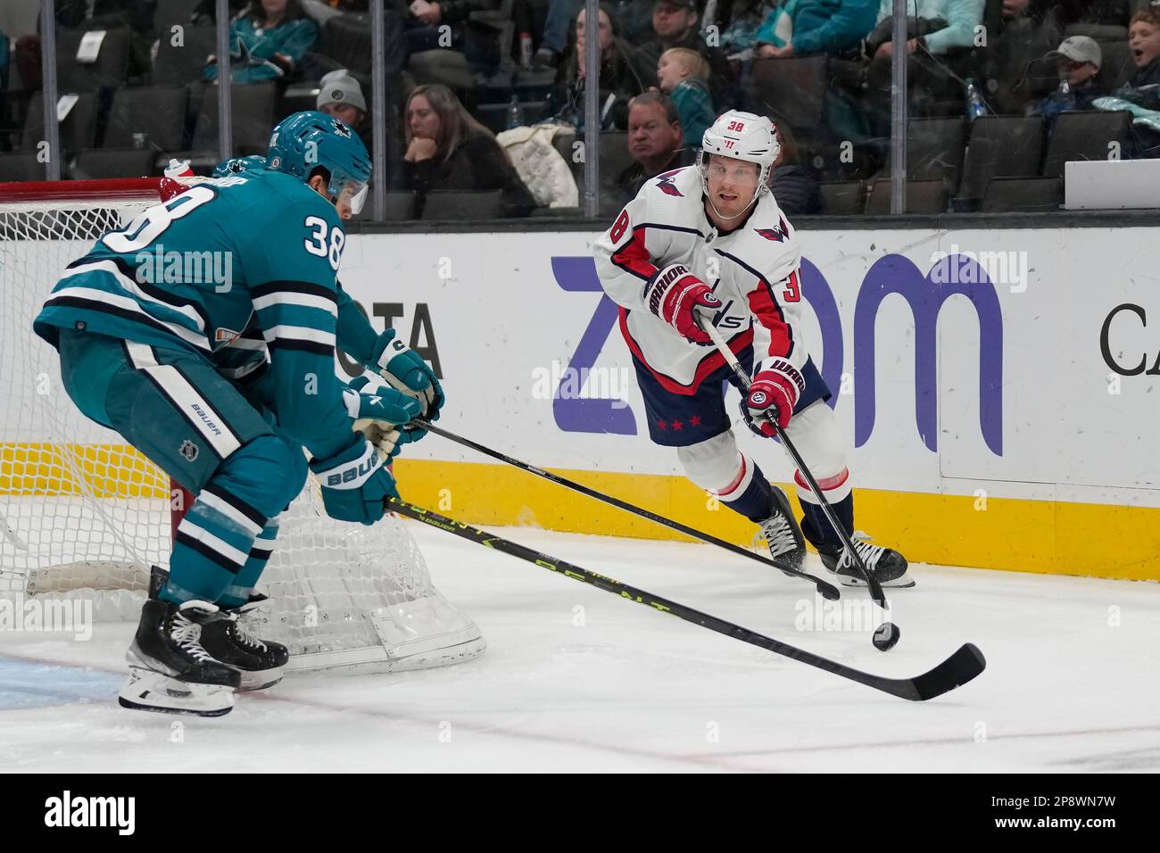 Washington Capitals defenseman Rasmus Sandin, right, skates against San ...