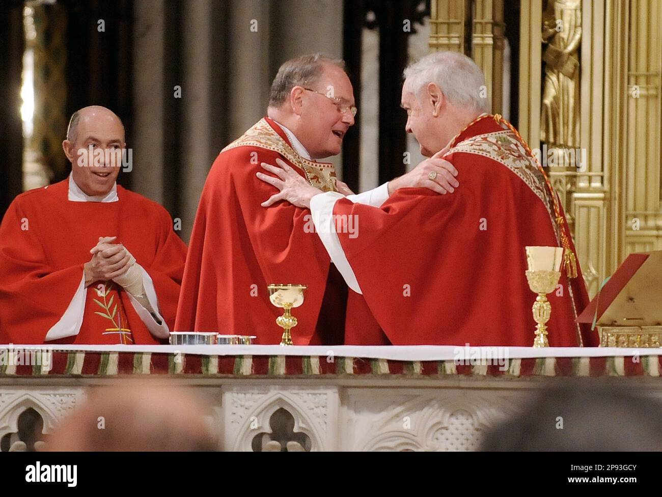Milwaukee Archbishop Timothy M. Dolan, center, comes face to face with ...