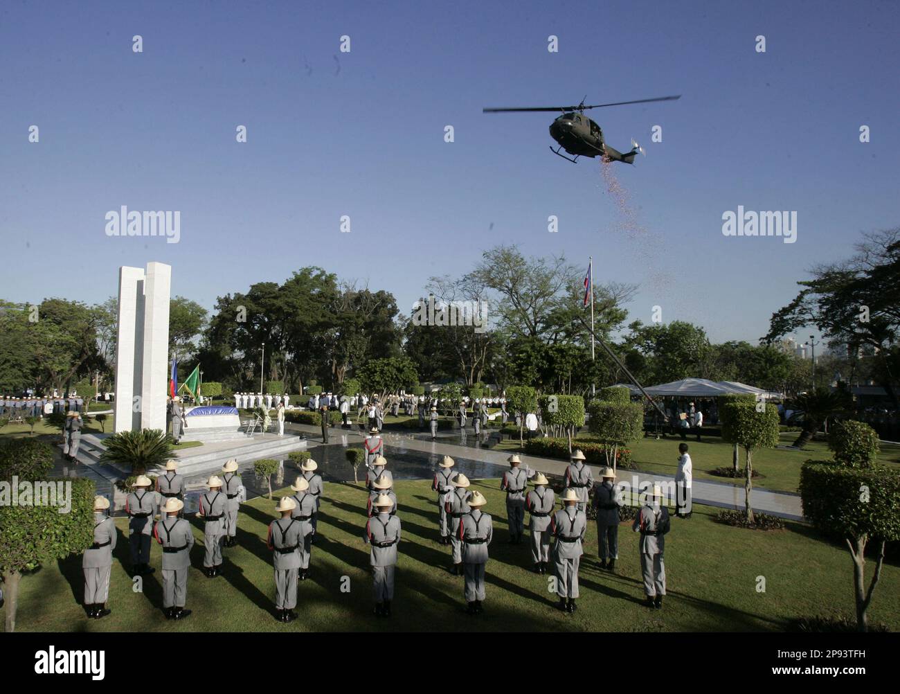 A Philippine Air Force helicopter hovers above Philippine troops to ...