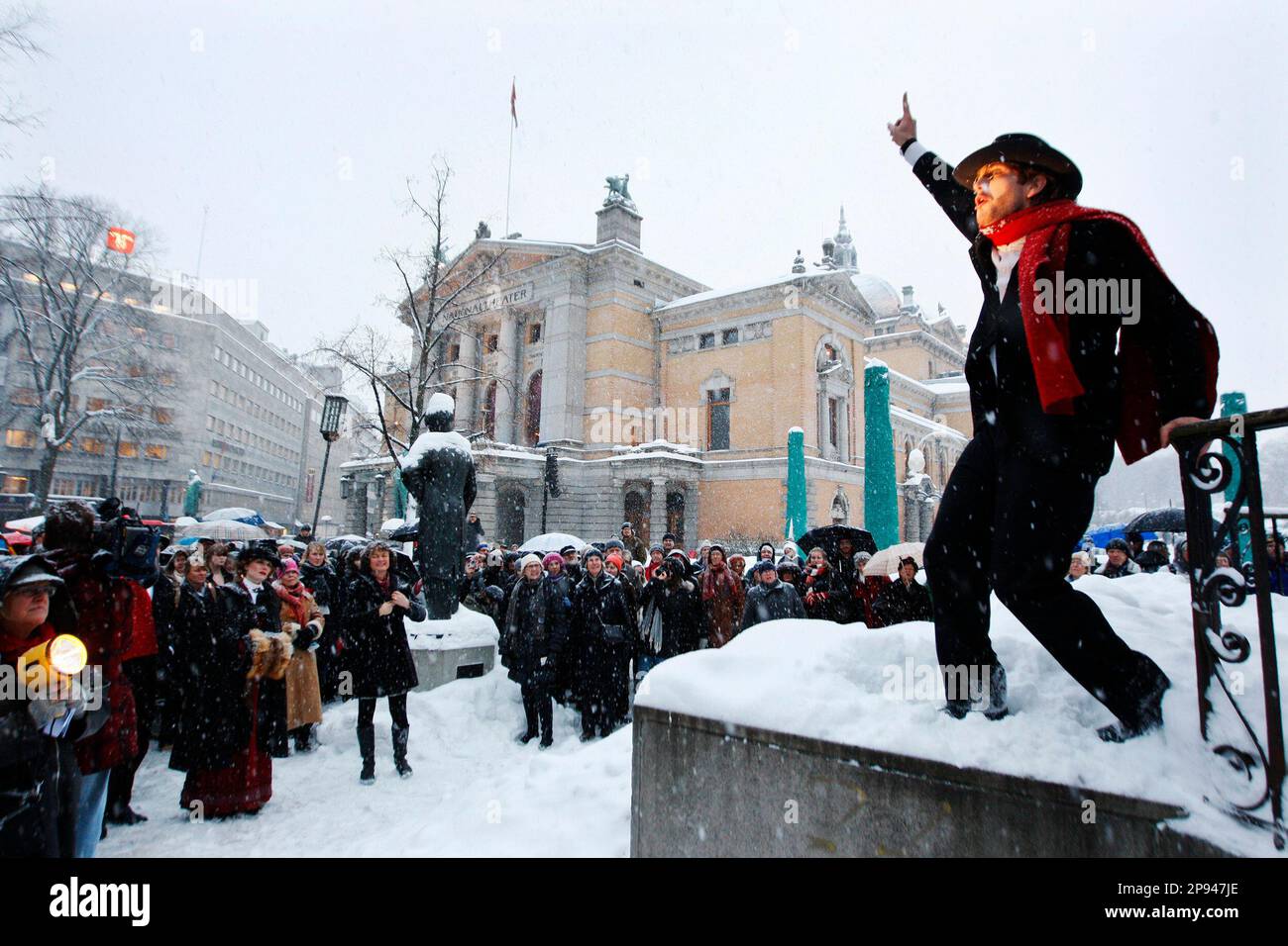 People follow a street theatre performance through Oslo as part of the ...