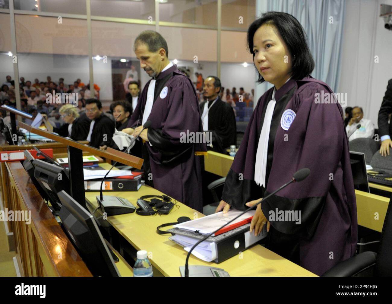 Co-prosecutors Chea Leang, right, and Robert Petit, left, gather at the ...