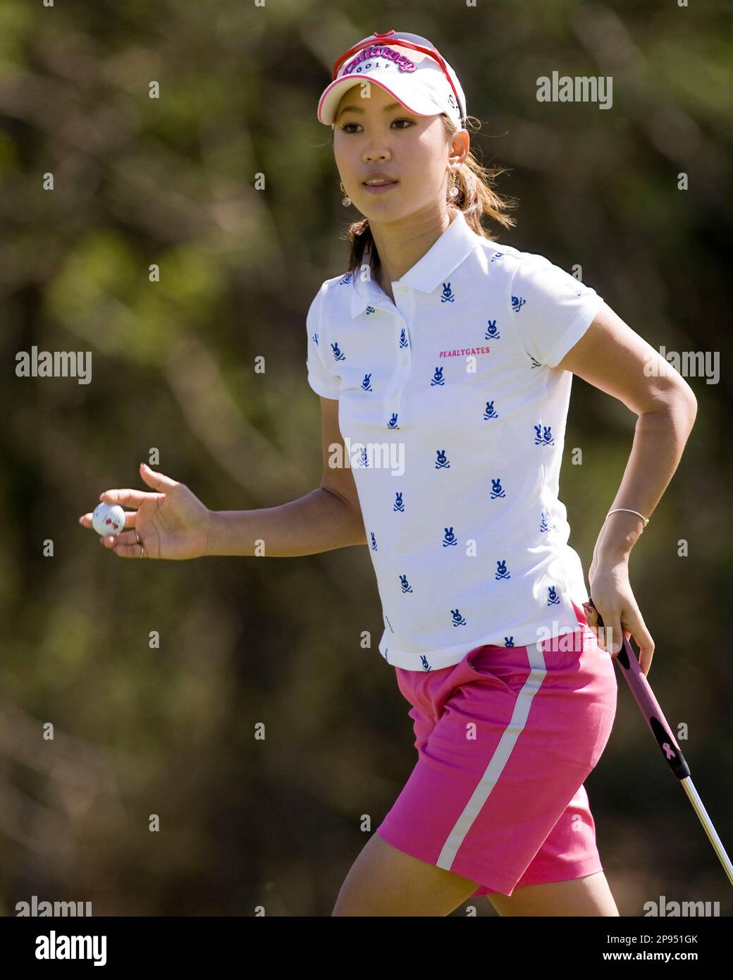 Momoko Ueda, of Japan, waves to the gallery after making her putt on the ninth green during the ...