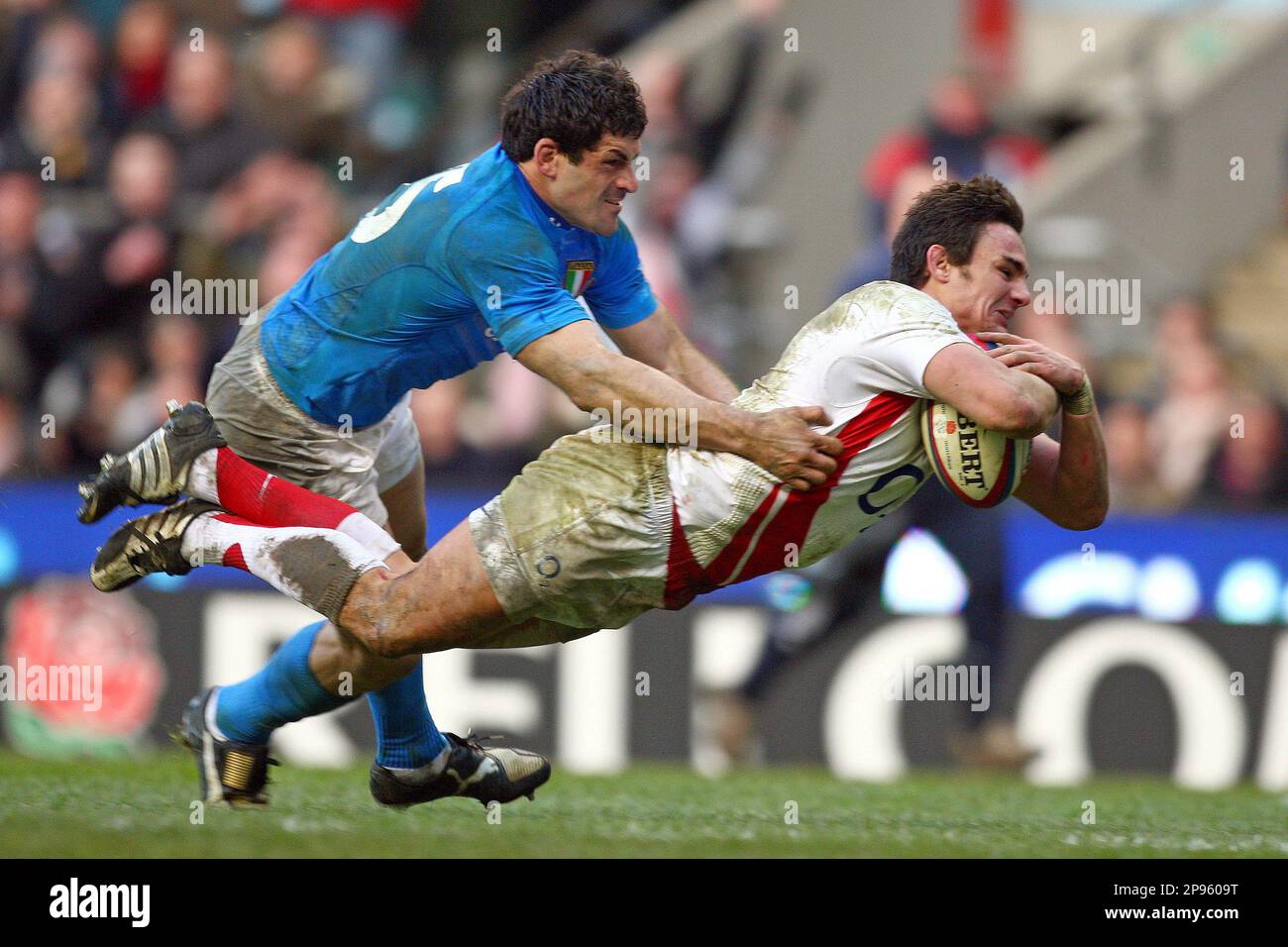 England's Harry Ellis, right, is tackled on the line by Italy's Andrea ...