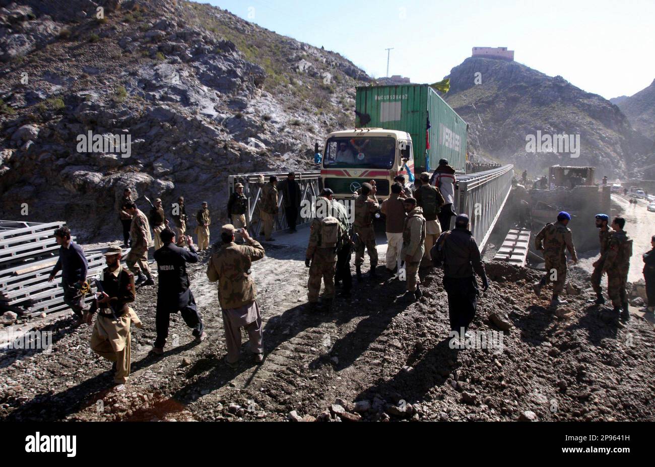 Soldiers of Pakistan's paramilitary force guard a newly built bridge to ...