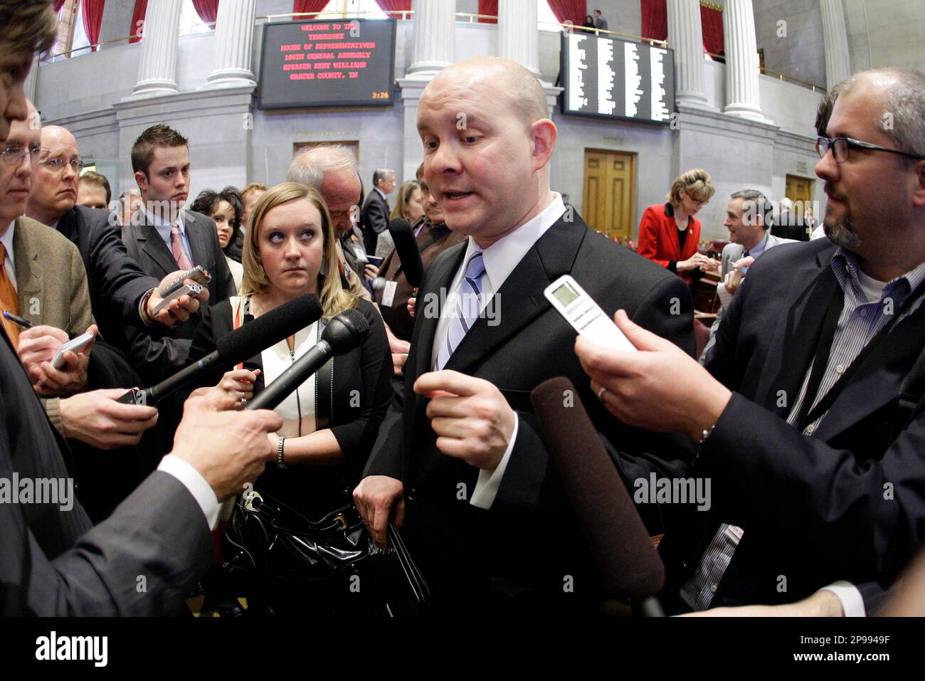 Rep. Jason Mumpower, R-Bristol, center, talks with reporters after the ...