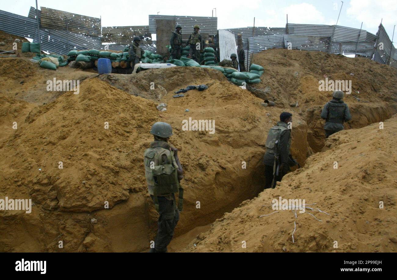 Sri Lankan soldiers are seen walking to a newly built bunker of the Sri ...