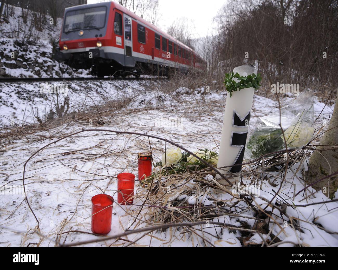 Flowers and candles have been put close to the place where German ...