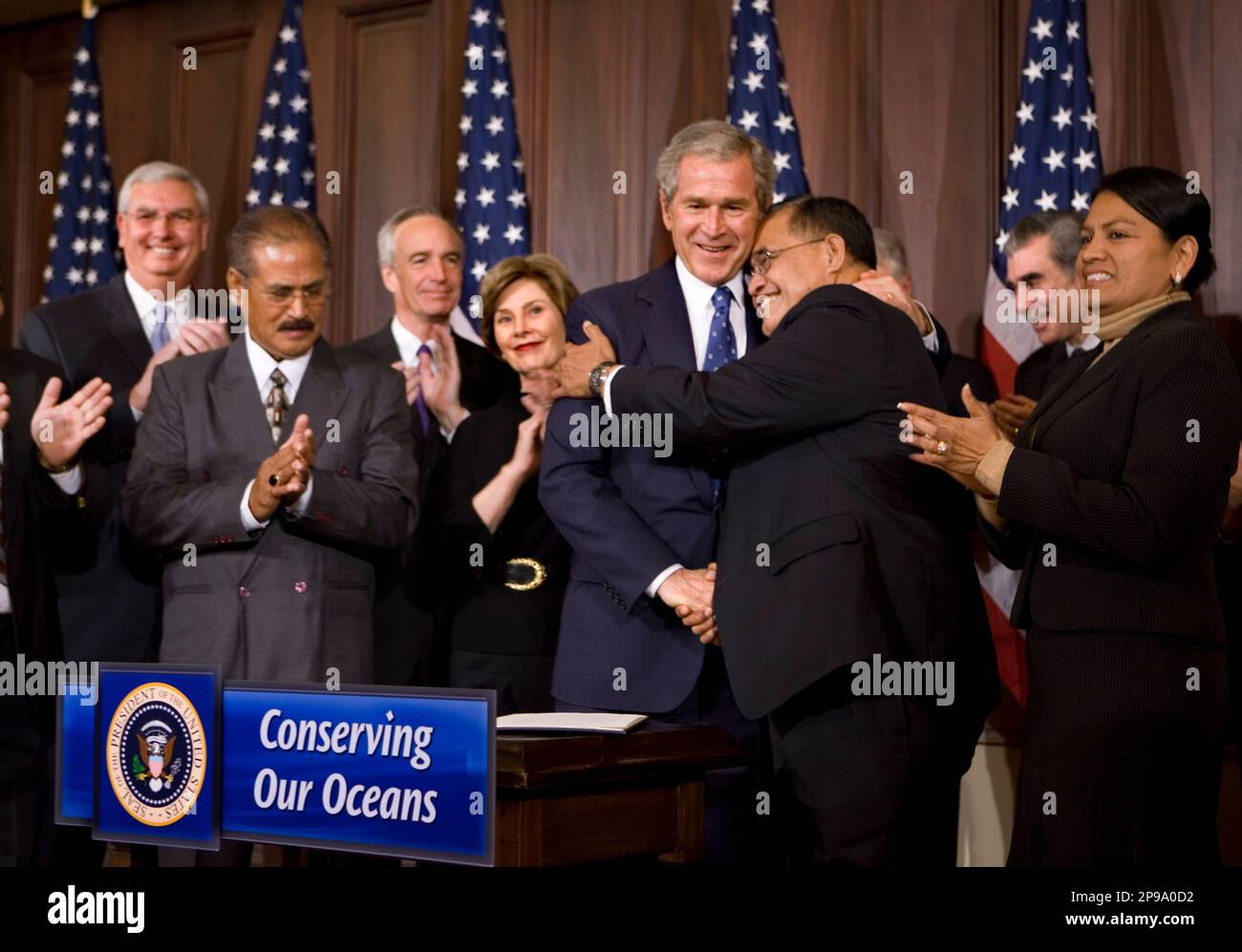 President George W. Bush is hugged by U.S. Commonwealth Northern ...