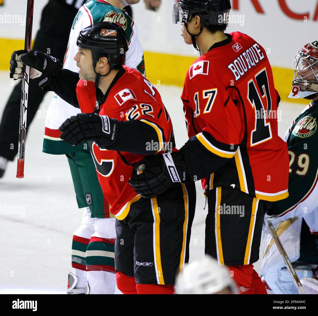 Calgary Flames' Daymond Langkow, left, celebrates scoring on Minnesota ...