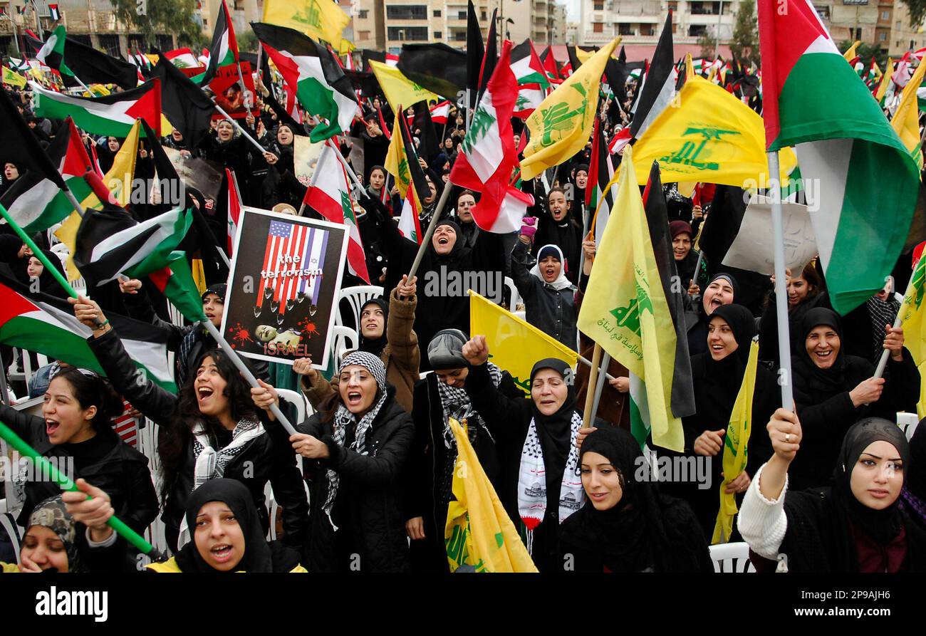 Lebanese women from Hezbollah wave Palestinian, Lebanese and yellow ...
