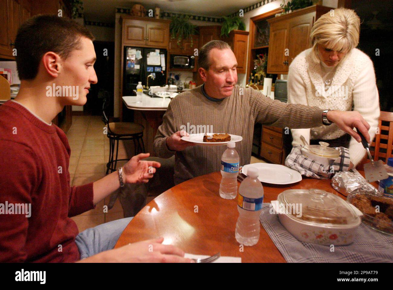 Joe DeRosa, center, has dinner with his family including his wife Patti ...