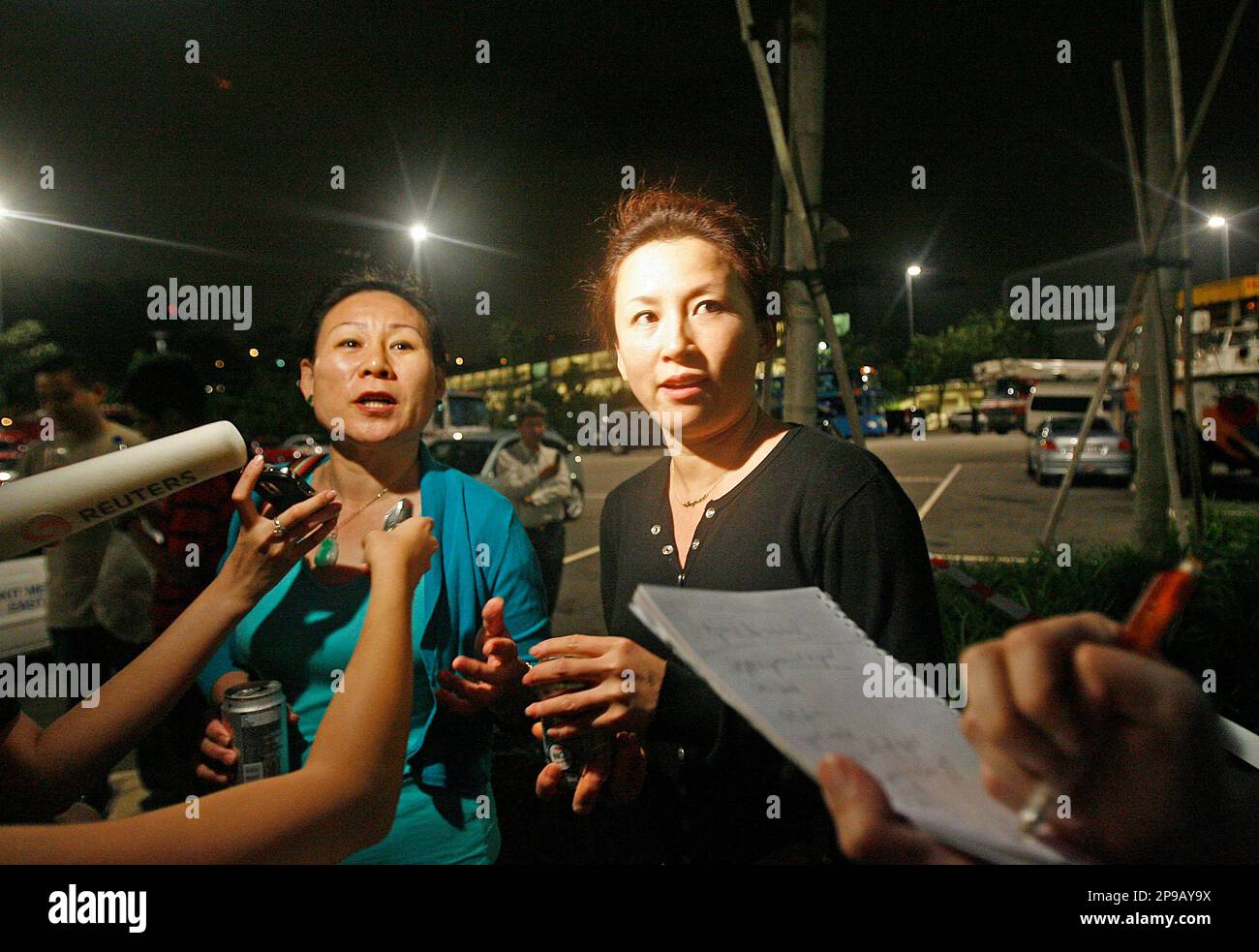 Passengers Cui Lin 52, left, and Cui Juan, 38, from Qingdao, China ...
