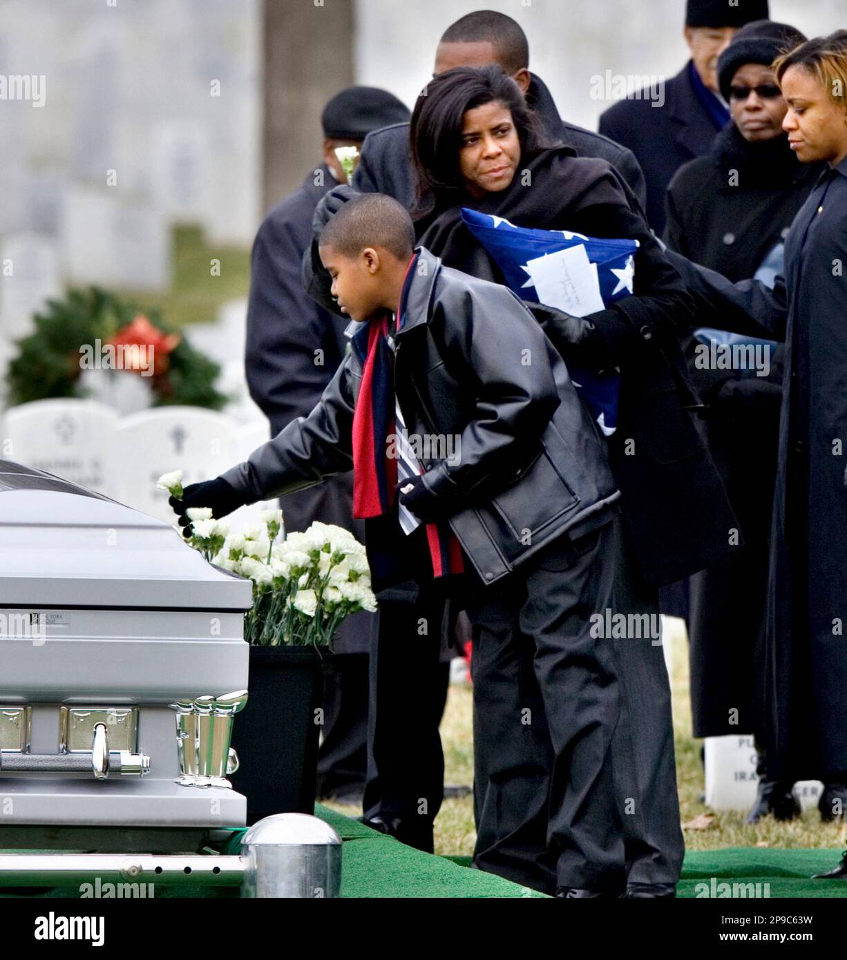 Family members and friends mourn at the funeral of Master Sgt. Anthony ...