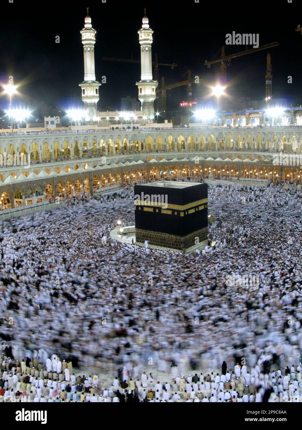 Tens of thousands of Muslim pilgrims move around the Kaaba, the black ...