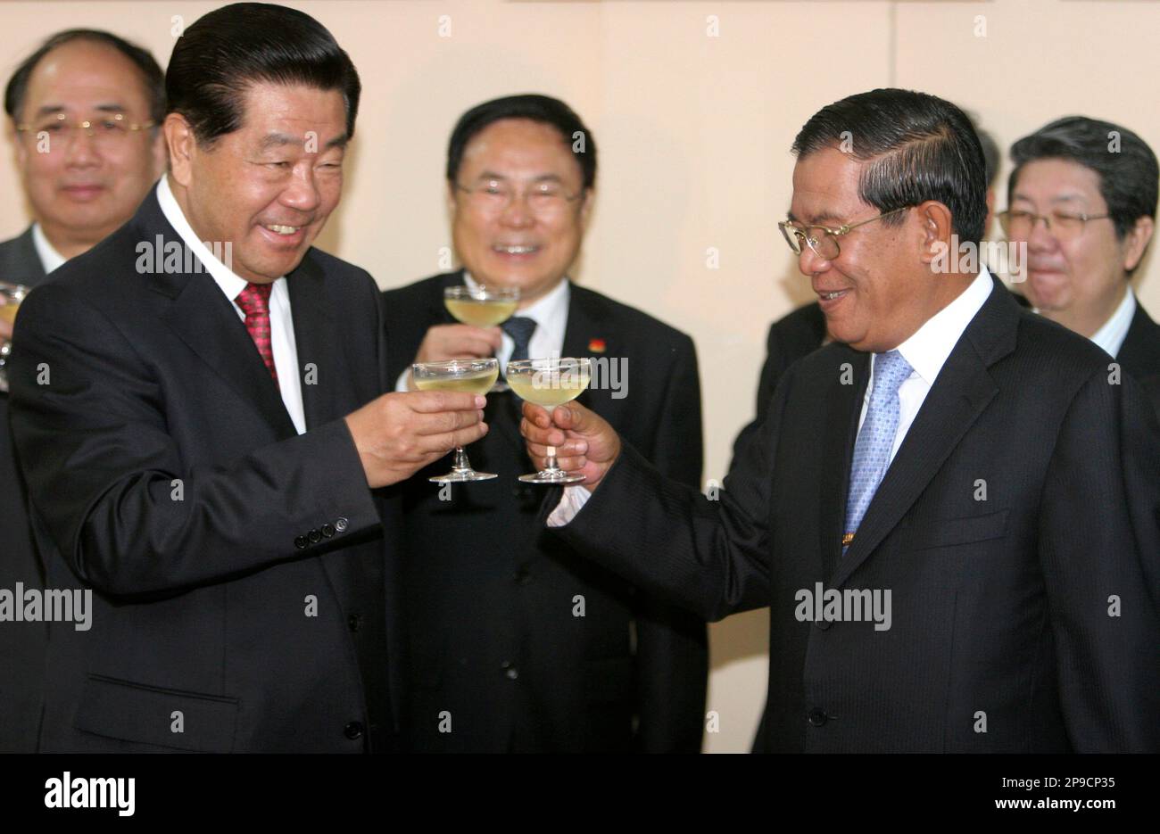 Cambodian Prime Minister Hun Sen, second right, toasts with Jia Qinglin ...