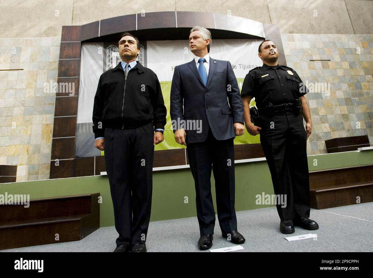 Tijuana's Mayor Jorge Ramos, center, attends the swearing in ceremony ...
