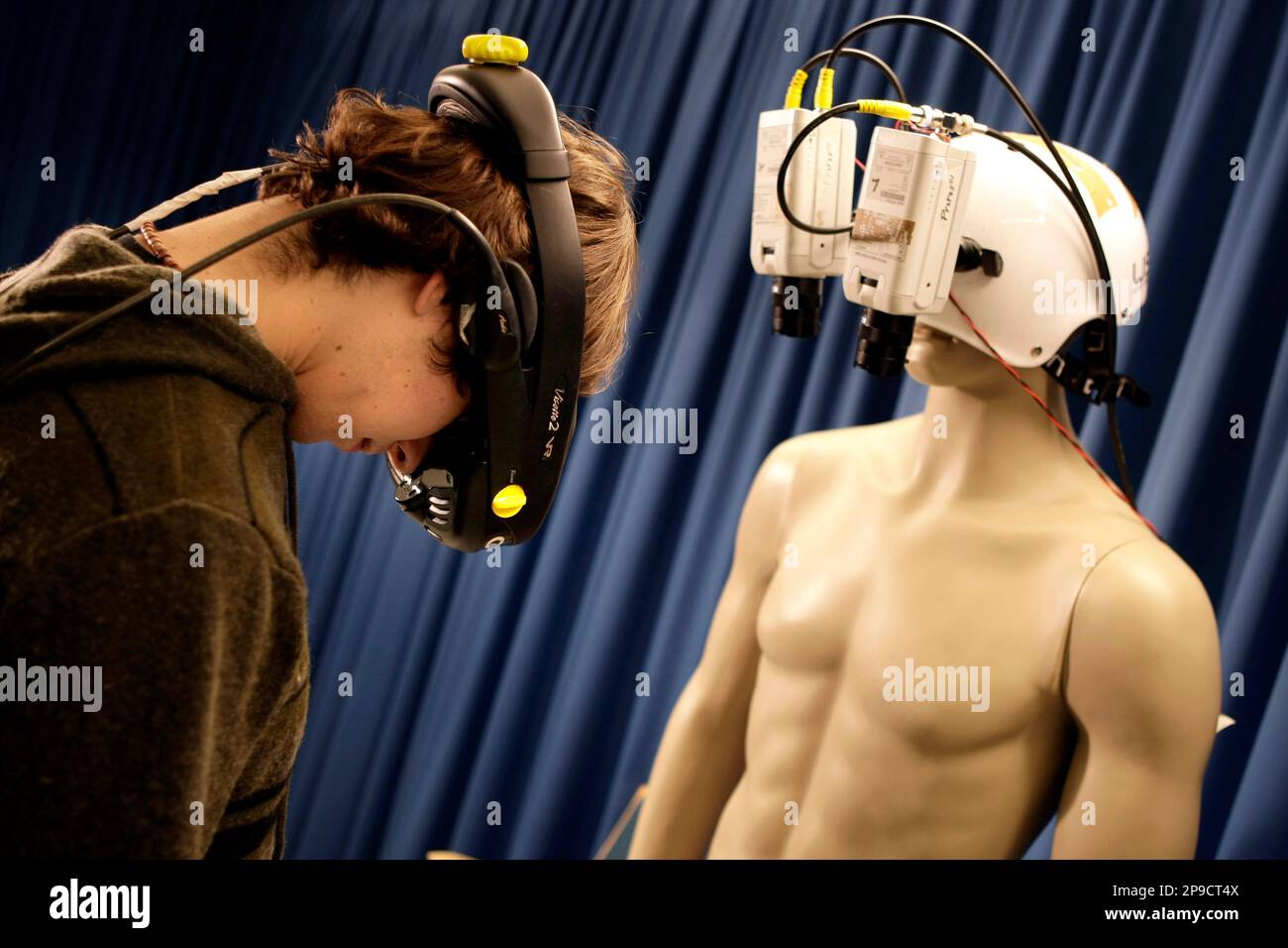 Karolinska Institute student Andrew Ketterer, left, faces a mannequin ...