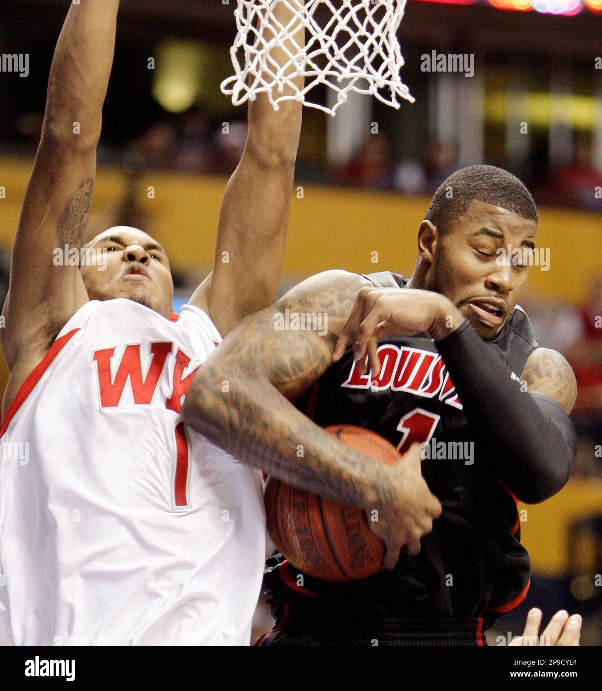 Louisville forward Terrence Williams, right, takes a rebound away from ...
