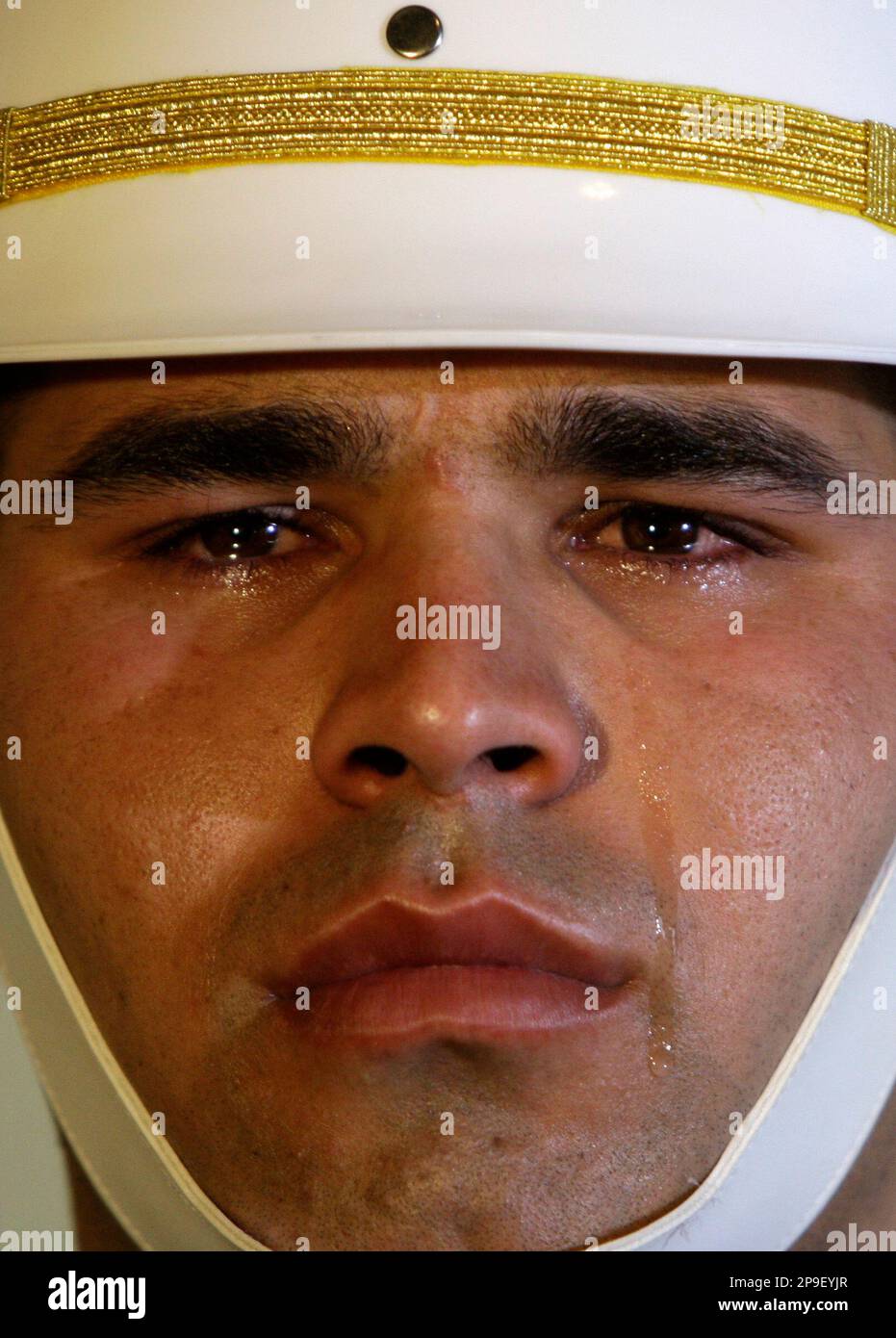 Tears shed from a Turkish soldier as he stands guard next to the death ...