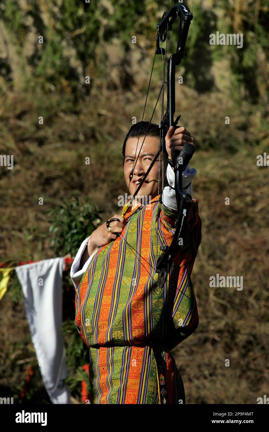Bhutan's fifth King Jigme Khesar Namgyal Wangchuk prepares to take aim ...