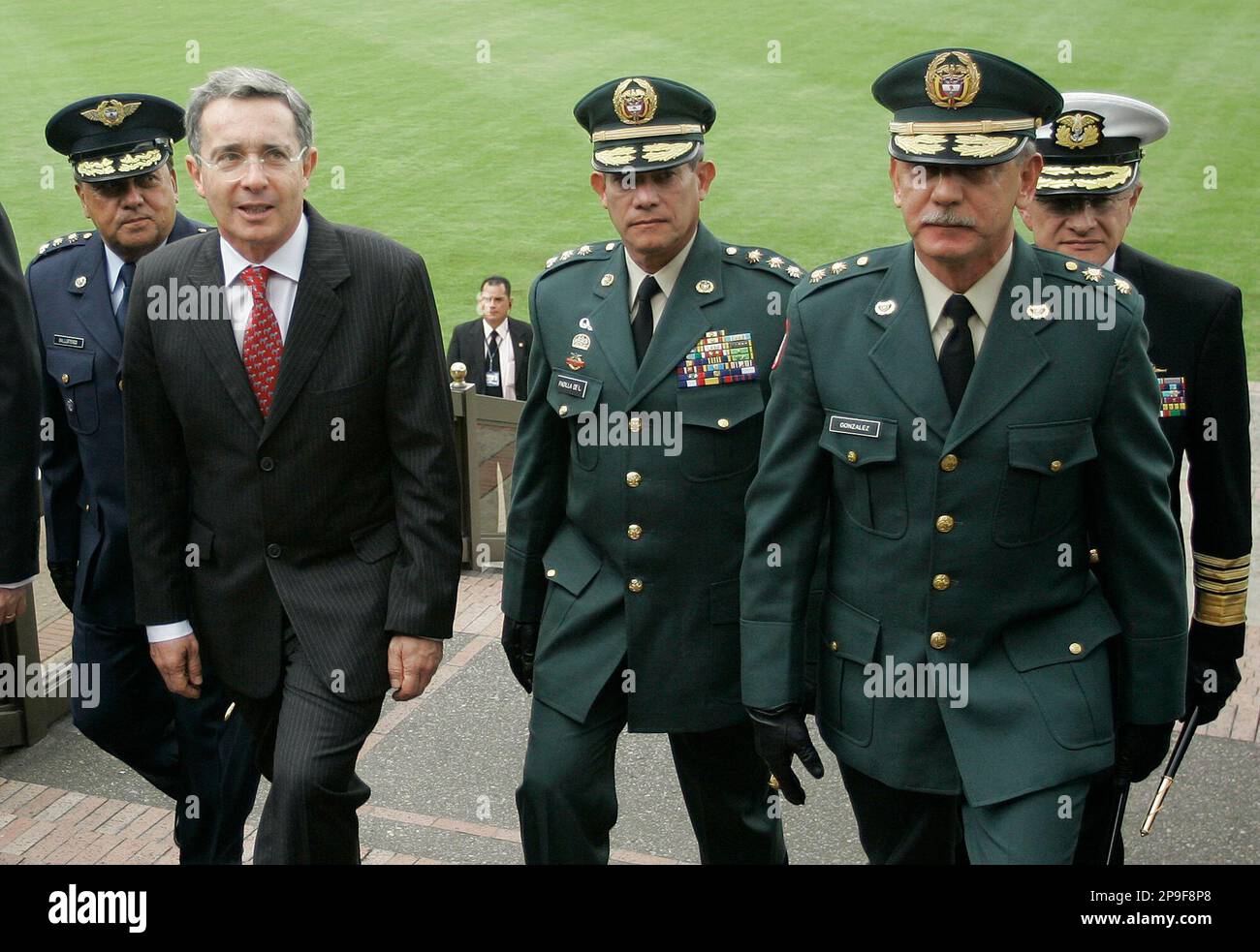 Colombia's President Alvaro Uribe, second from left, walks with the ...