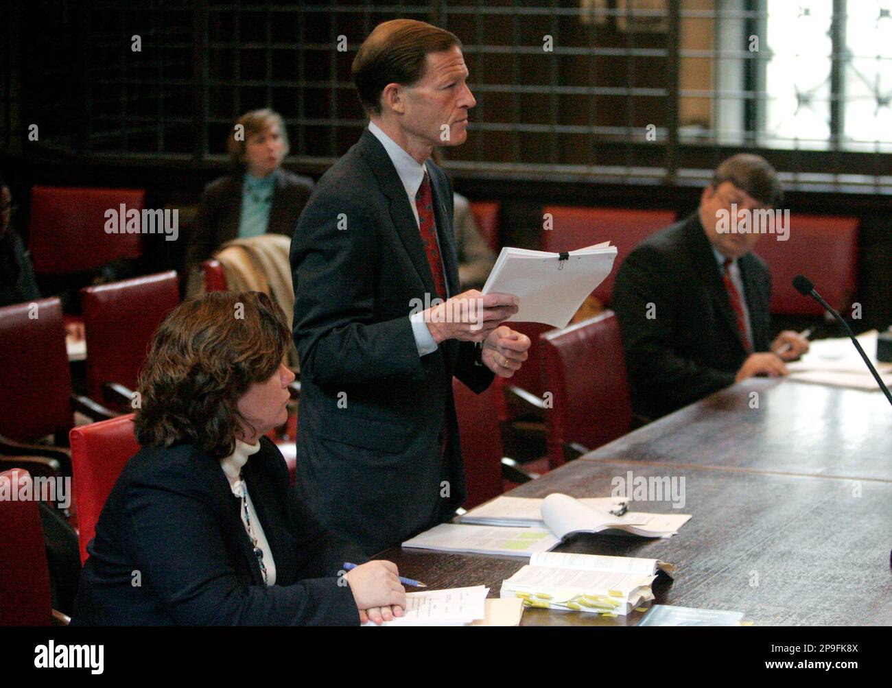 Connecticut state Attorney General Richard Blumenthal, center, argues ...
