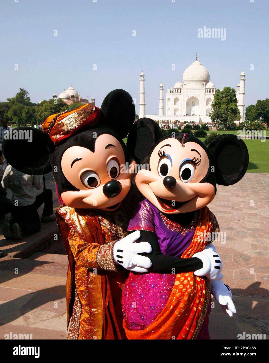 Walt Disney cartoon characters Mickey Mouse, left, and Minnie Mouse ...