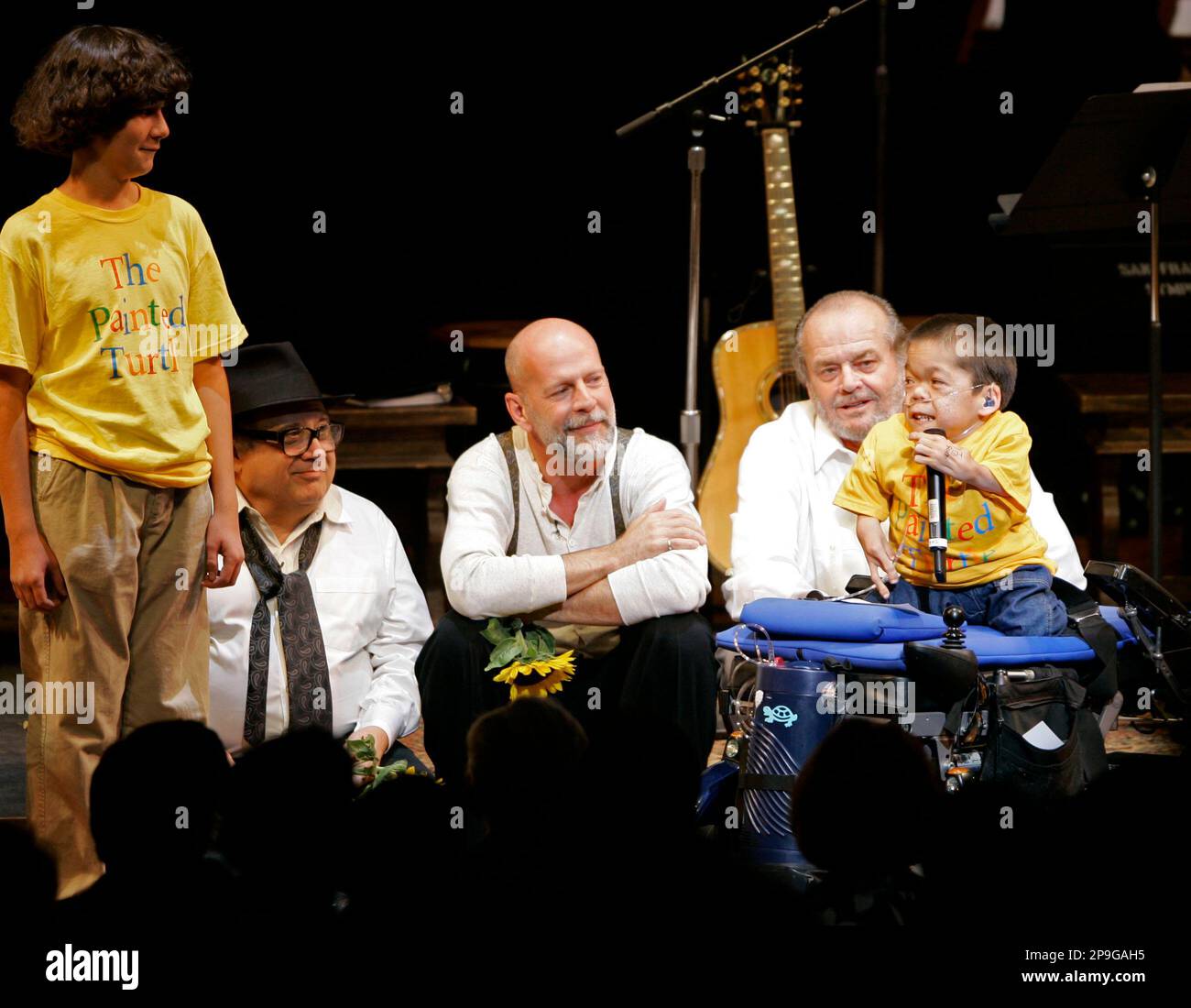 From left, Danny DeVito, Bruce Willis, and Jack Nicholson listen to ...