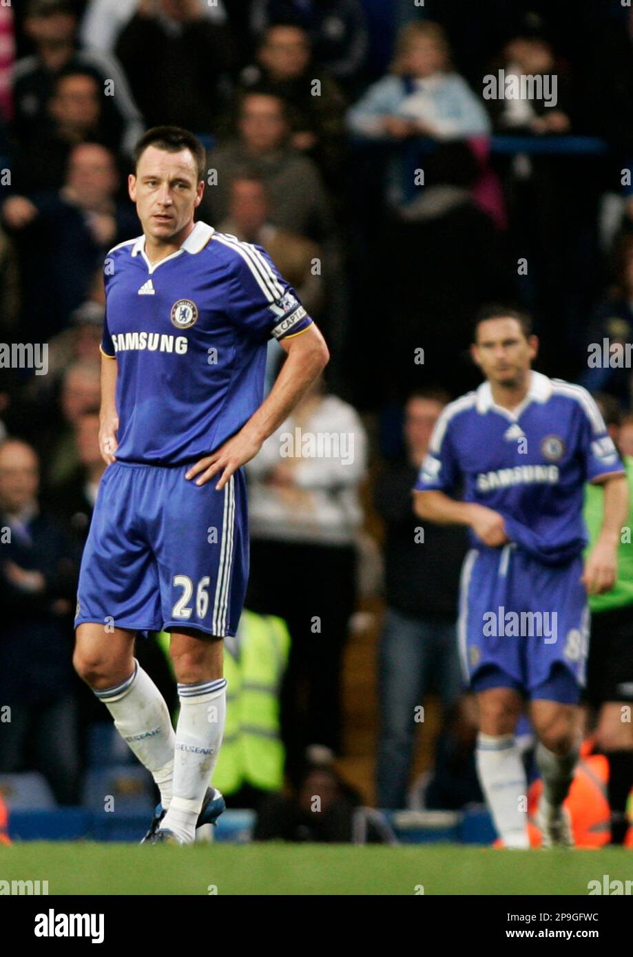 Chelsea's captain John Terry, left, reacts after their defeat against ...