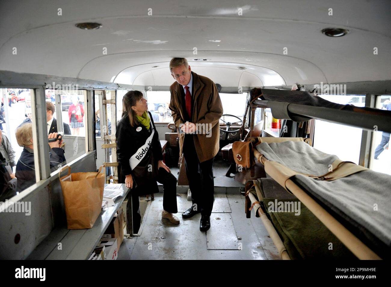 Sweden's Foreign Minister Carl Bildt is shown the interior of a "white ...