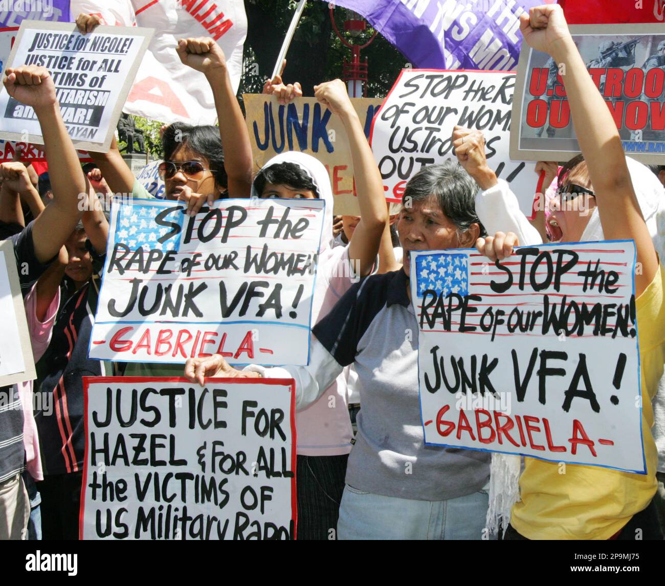 Protesters raise theire clenched fist while shouting slogans during a ...