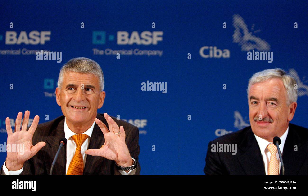 BASF CEO Juergen Hambrecht, left, and Armin Meyer, chairman of the board of Ciba, inform the ...