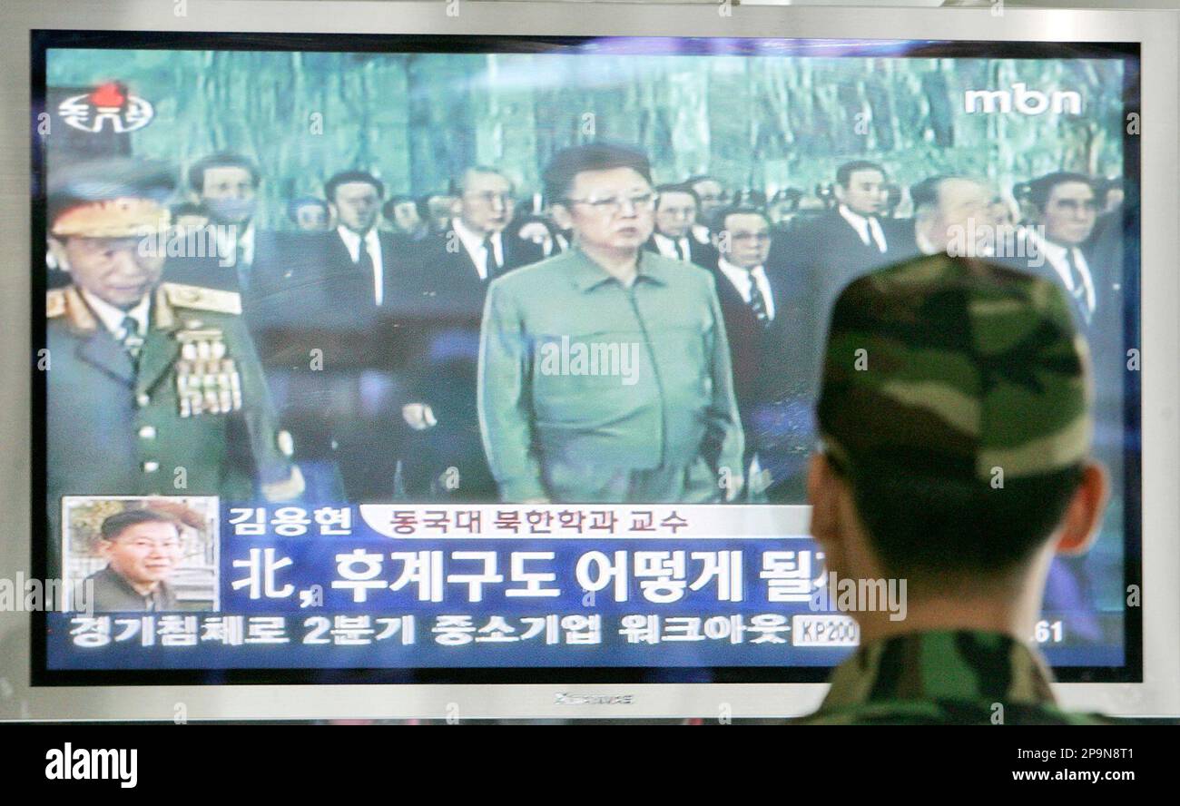 A South Korean Army soldier watches TV program reporting on North ...