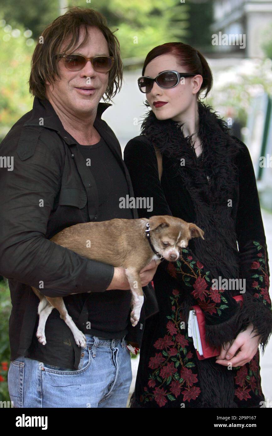 Actor Mickey Rourke, right, with his dog Loki, and actress Evan Rachel ...