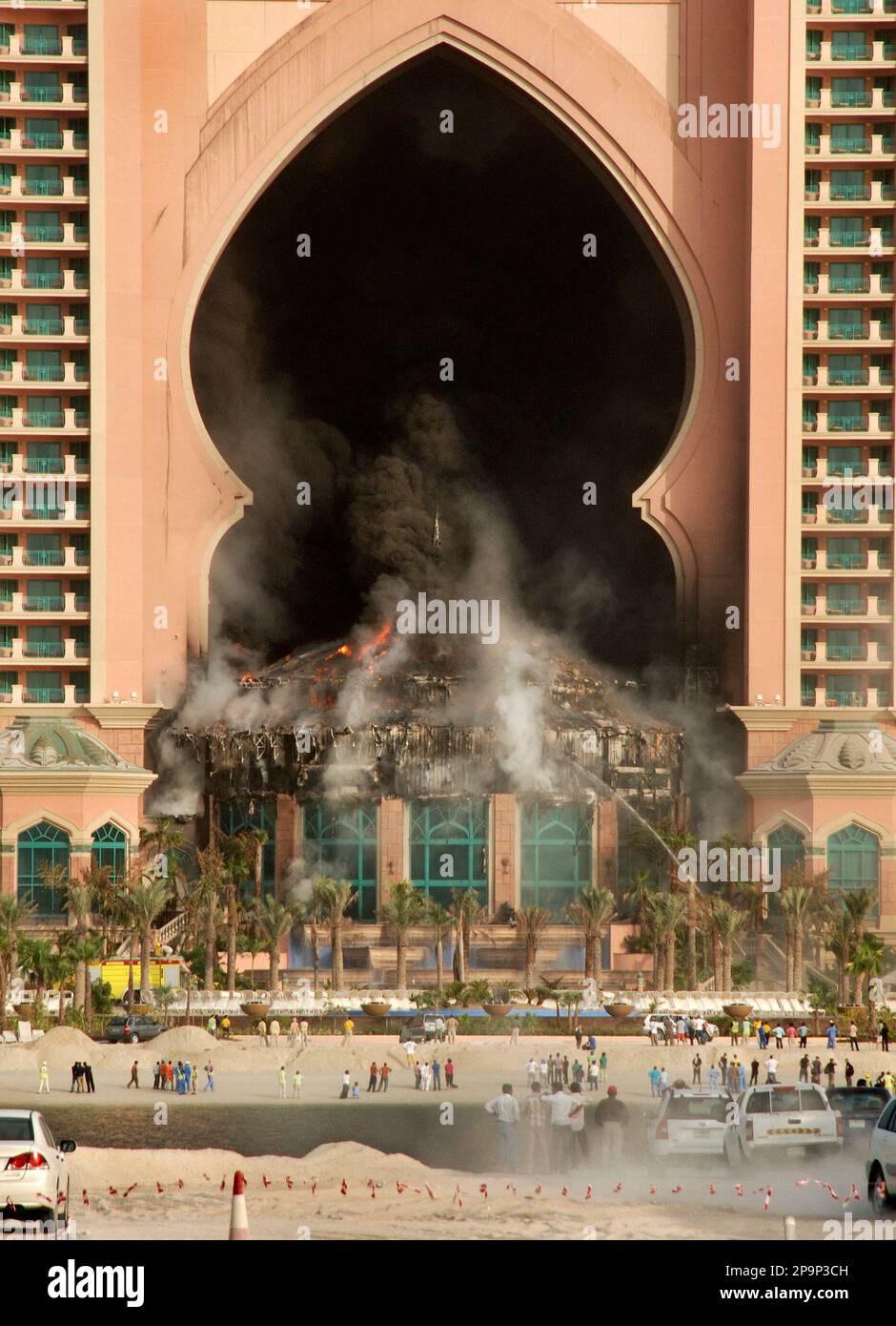** EDS NOTE: RECROP OF CAI101 ** A fire burns in the five-star Atlantis ...