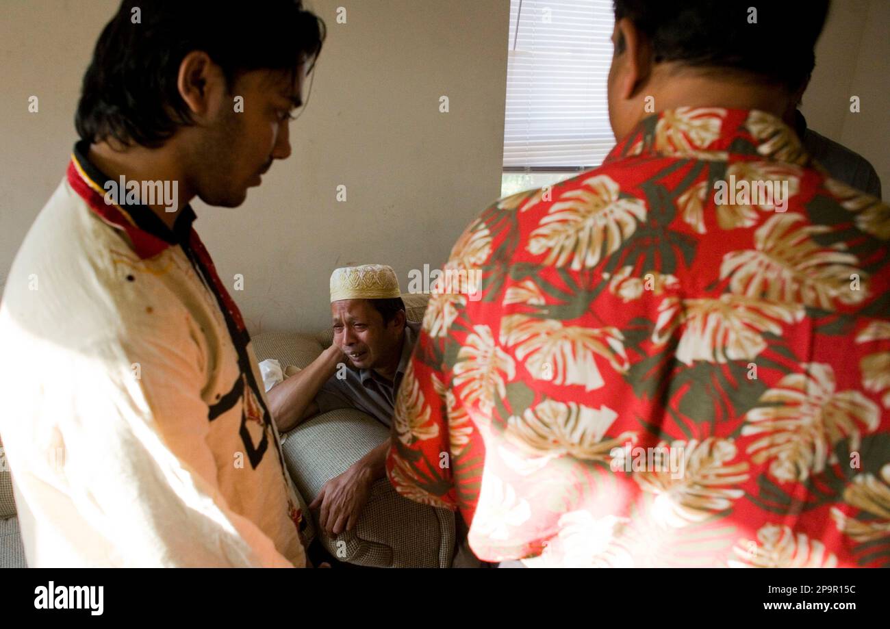 Syed Alam, the father of Fakhur Uddin grieves in his home with friends ...