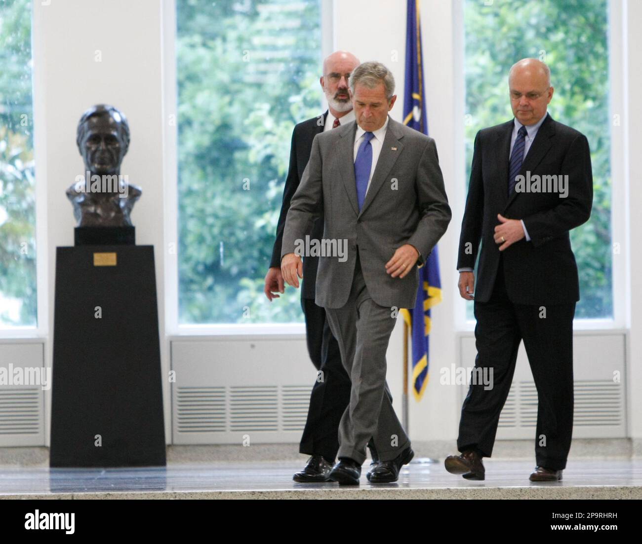 President Bush walks with CIA Director Michael Hayden, right, and ...