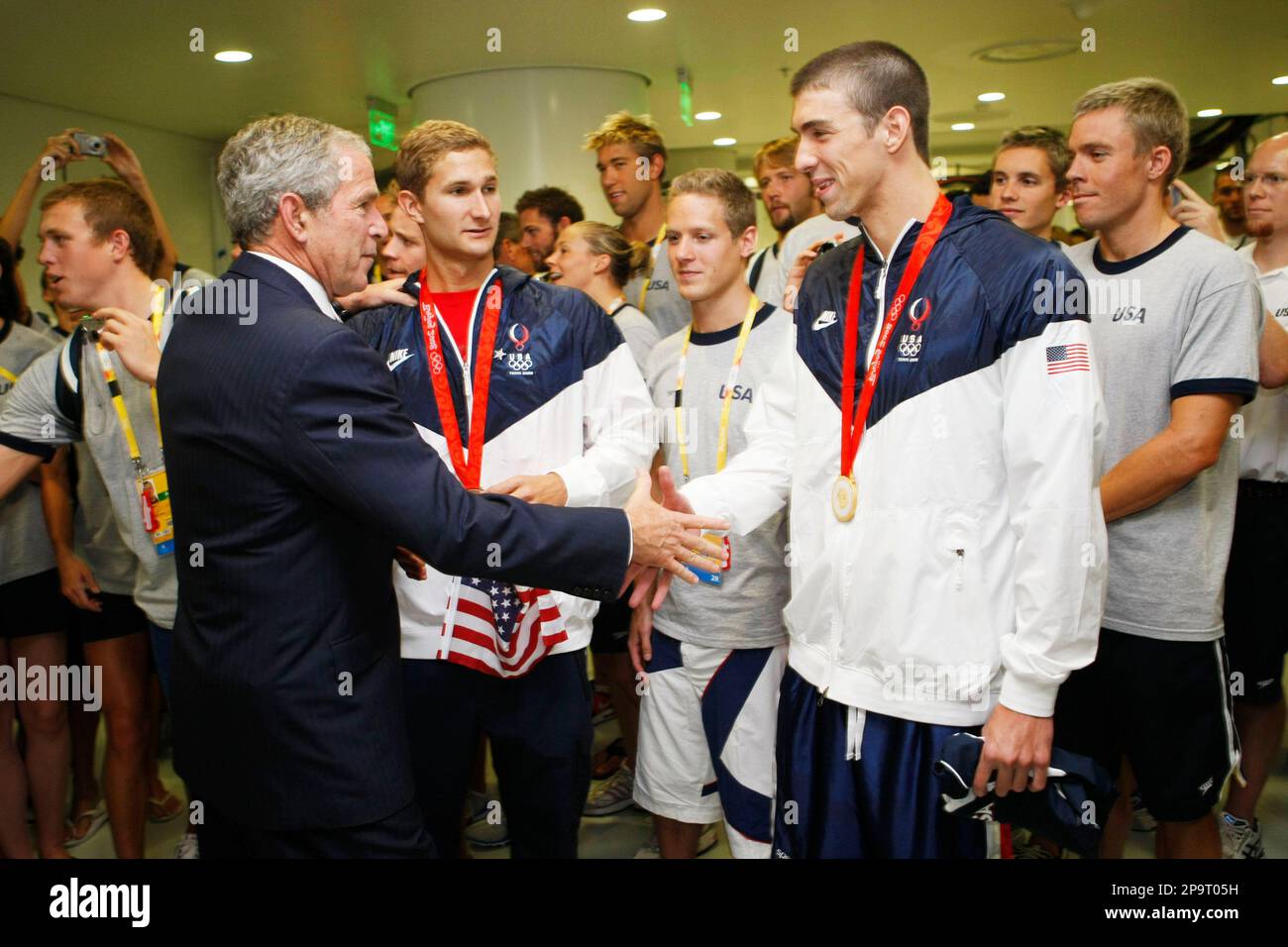 President Bush, greets gold medal and world record winner Michael ...