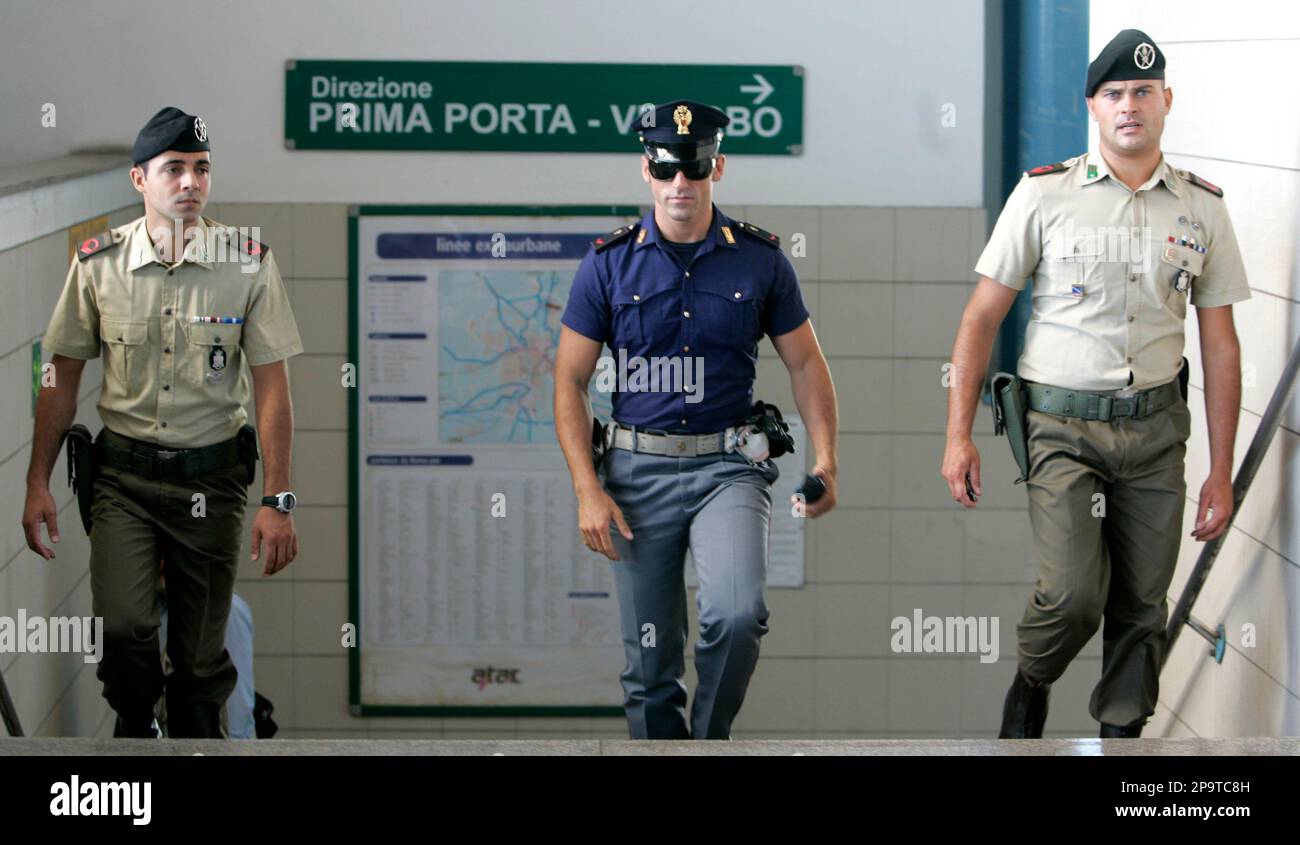 Two Italian Army soldiers, at left and right in khaki uniforms, on ...
