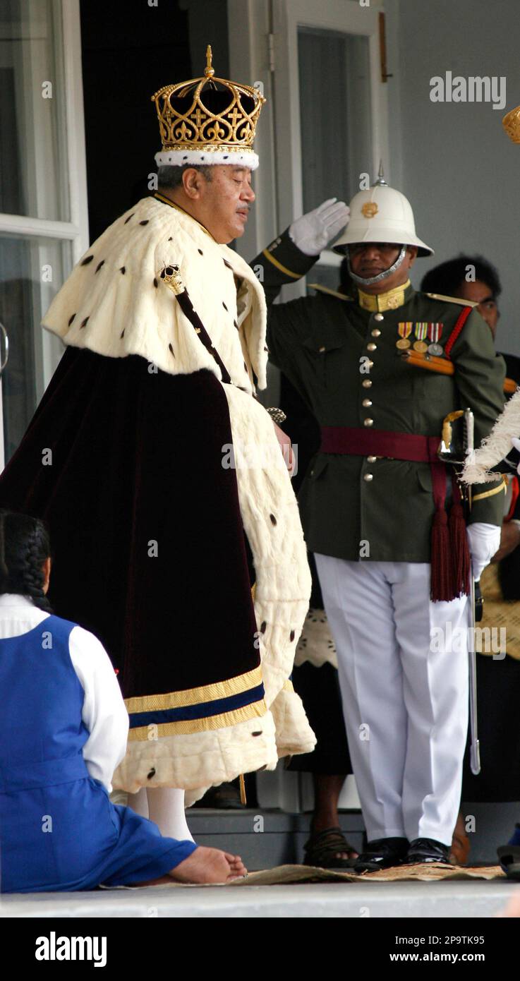 Tongan King George Tupou V is saluted as he leaves the capital's ...