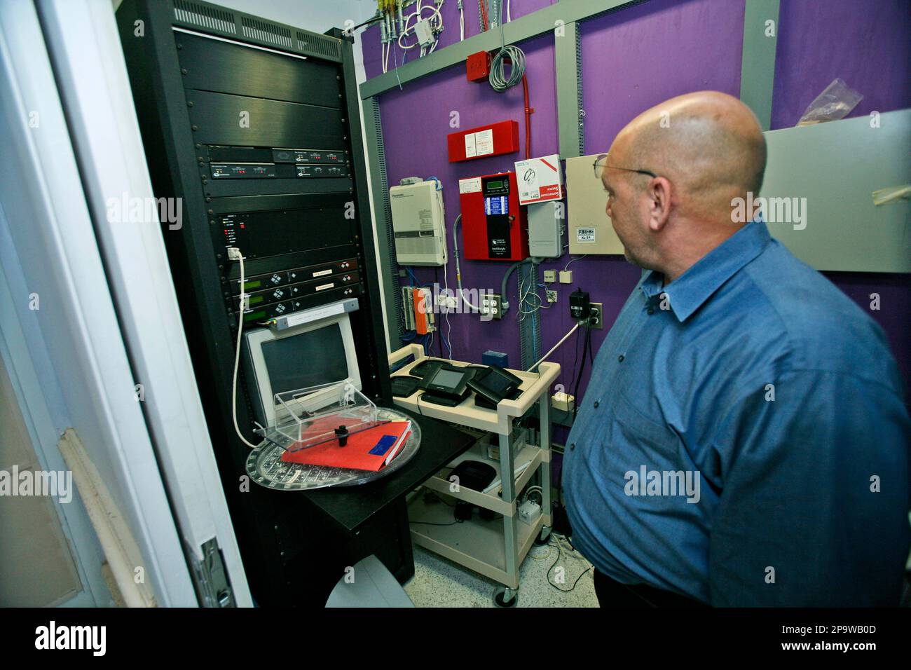 Jim McGuire, director of the Ann Storck Center shows off the computer ...