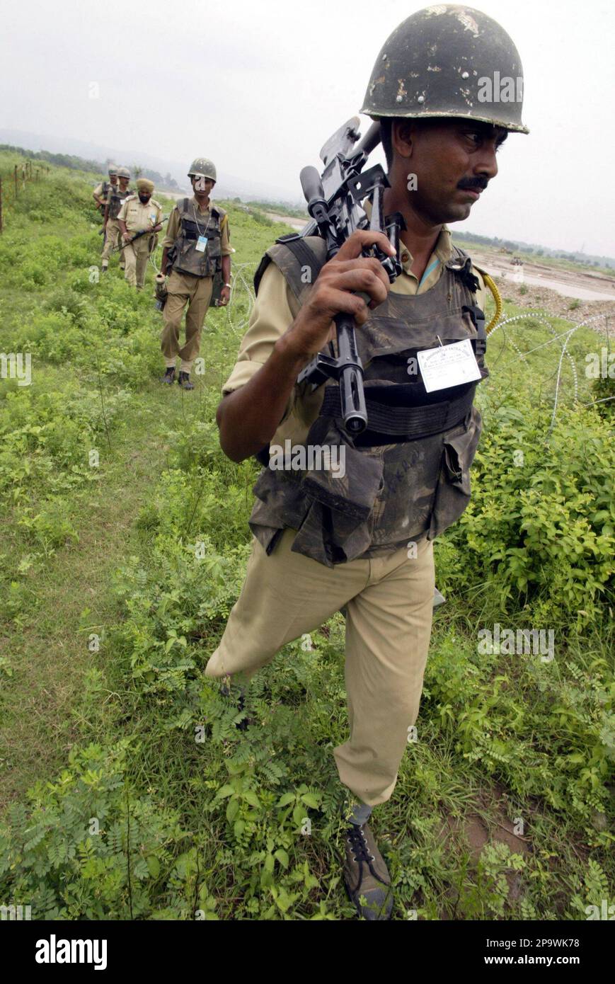 Indian paramilitary soldiers patrol outside the base camp of pilgrims ...