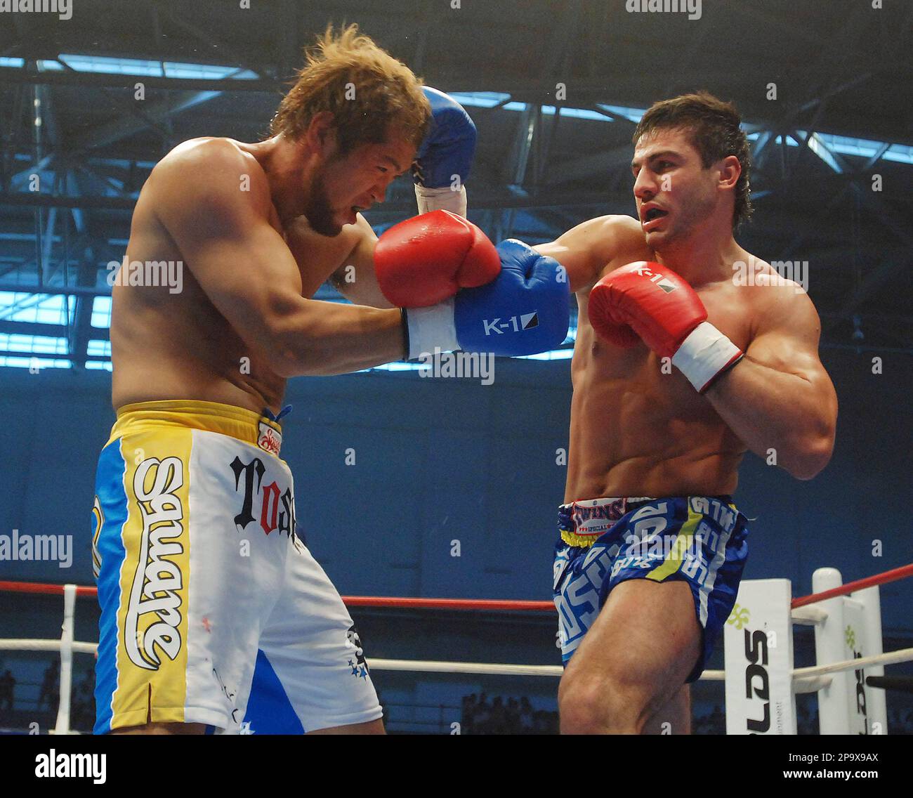 Ruslan Karaev from Russia, right, and Tatsufumi Tomihira from Japan compete in the K-1 World ...